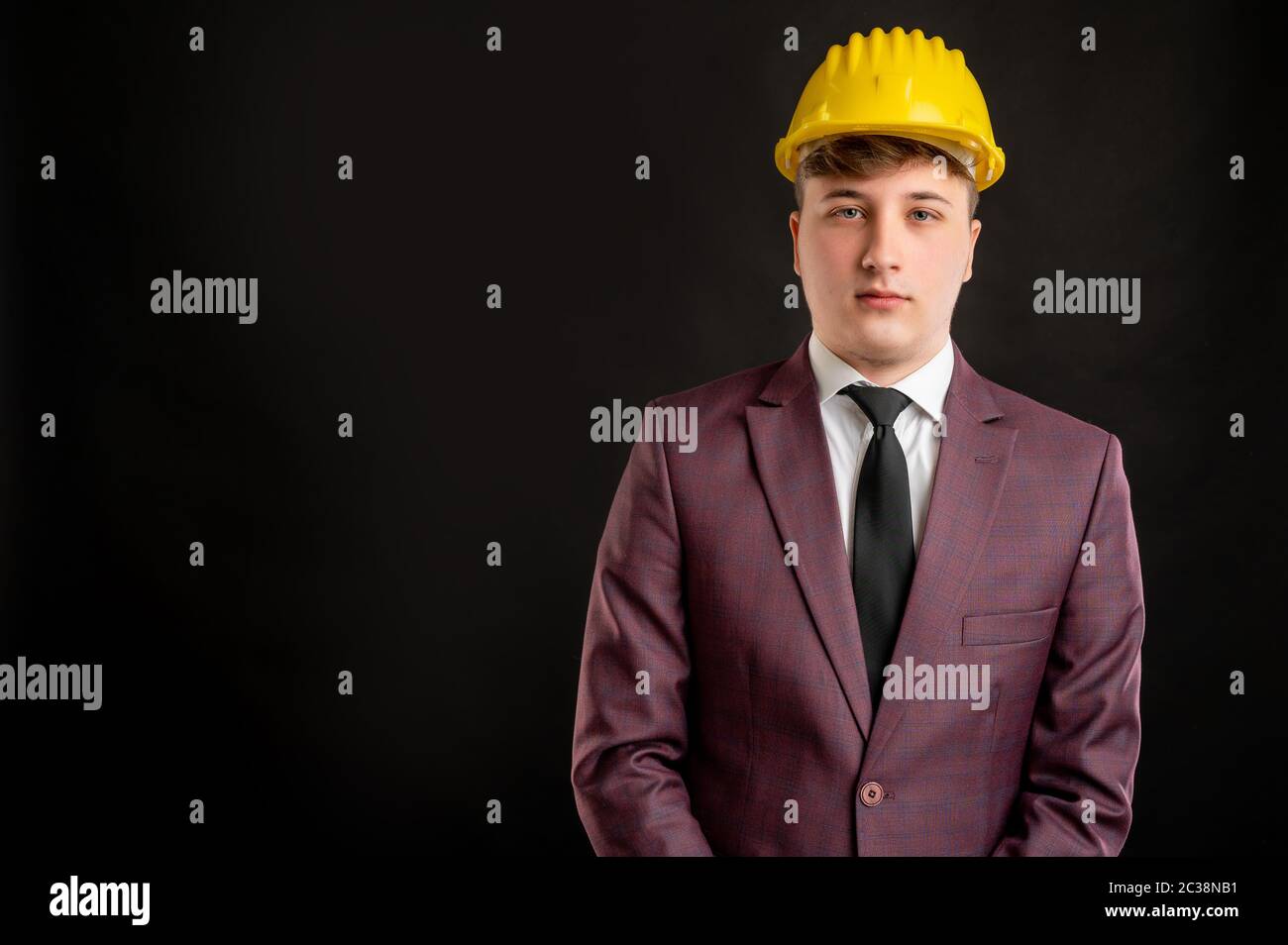 Portrait of engineer architect builder with blond hair wears a yellow ...