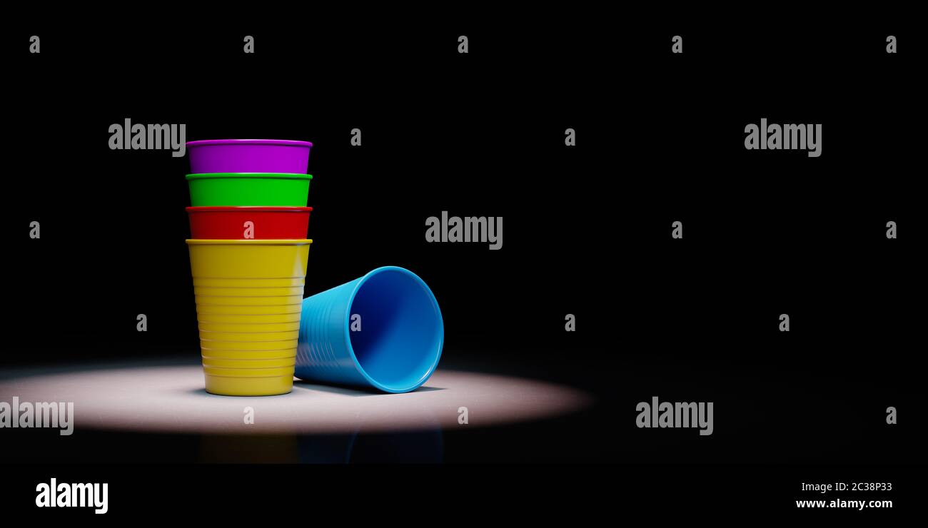 Pile of Colorful Plastic Cups Spotlighted on Black Background with Copy ...