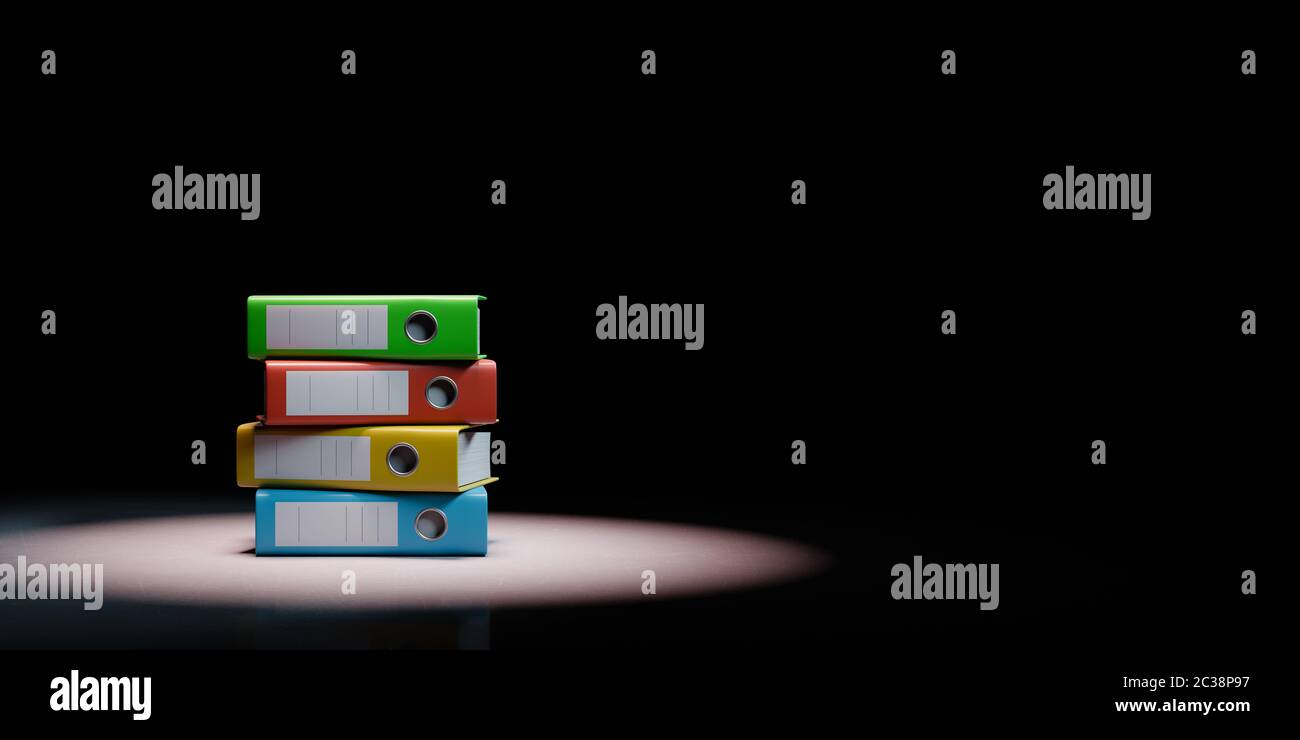 Heap of Colorful Binders Spotlighted on Black Background with Copy ...