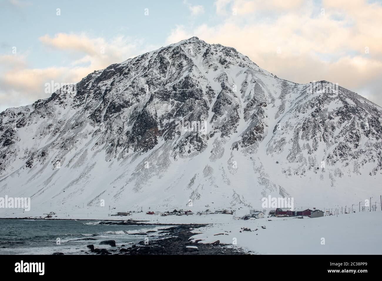Arctic surf beach and a snowy mountain backdrop Stock Photo - Alamy