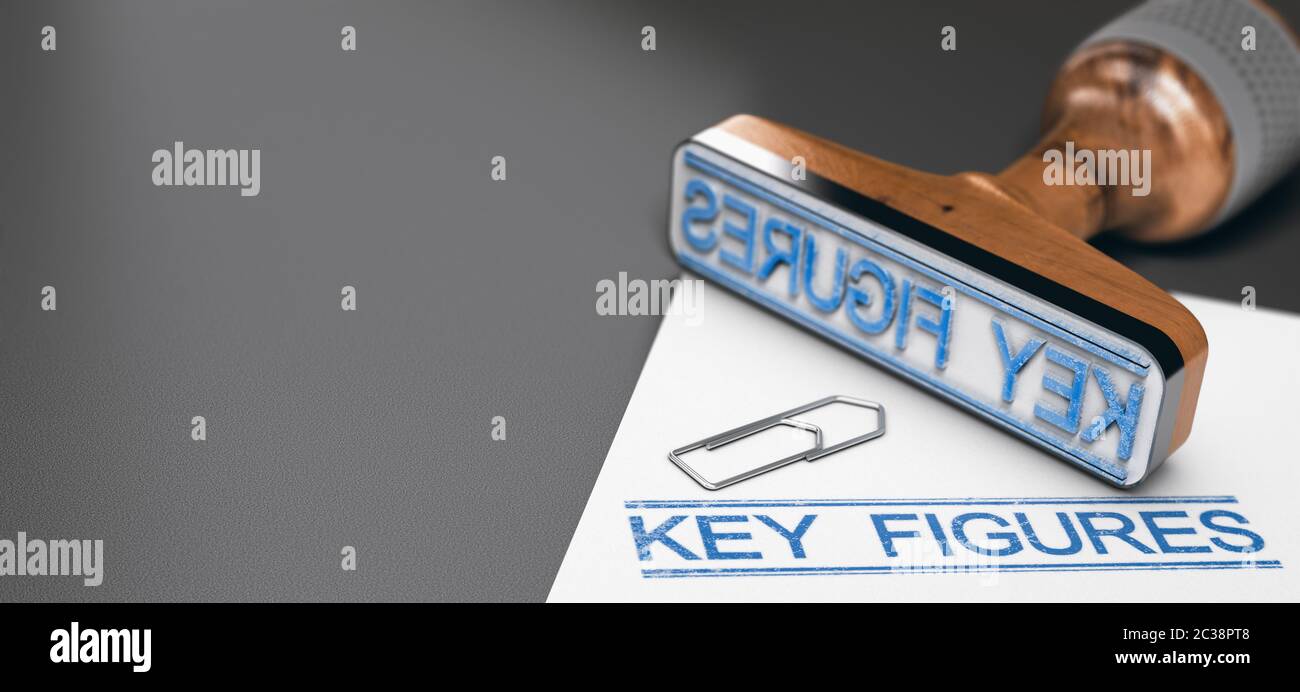 Text key figures printed on a sheet of paper and a rubber stamp over ...