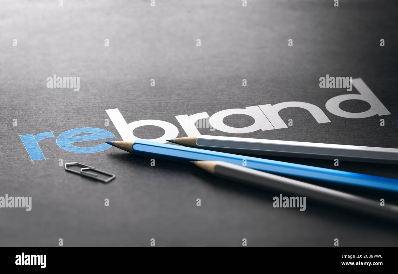 Word rebrand with the prefix re handwritten over black paper background ...