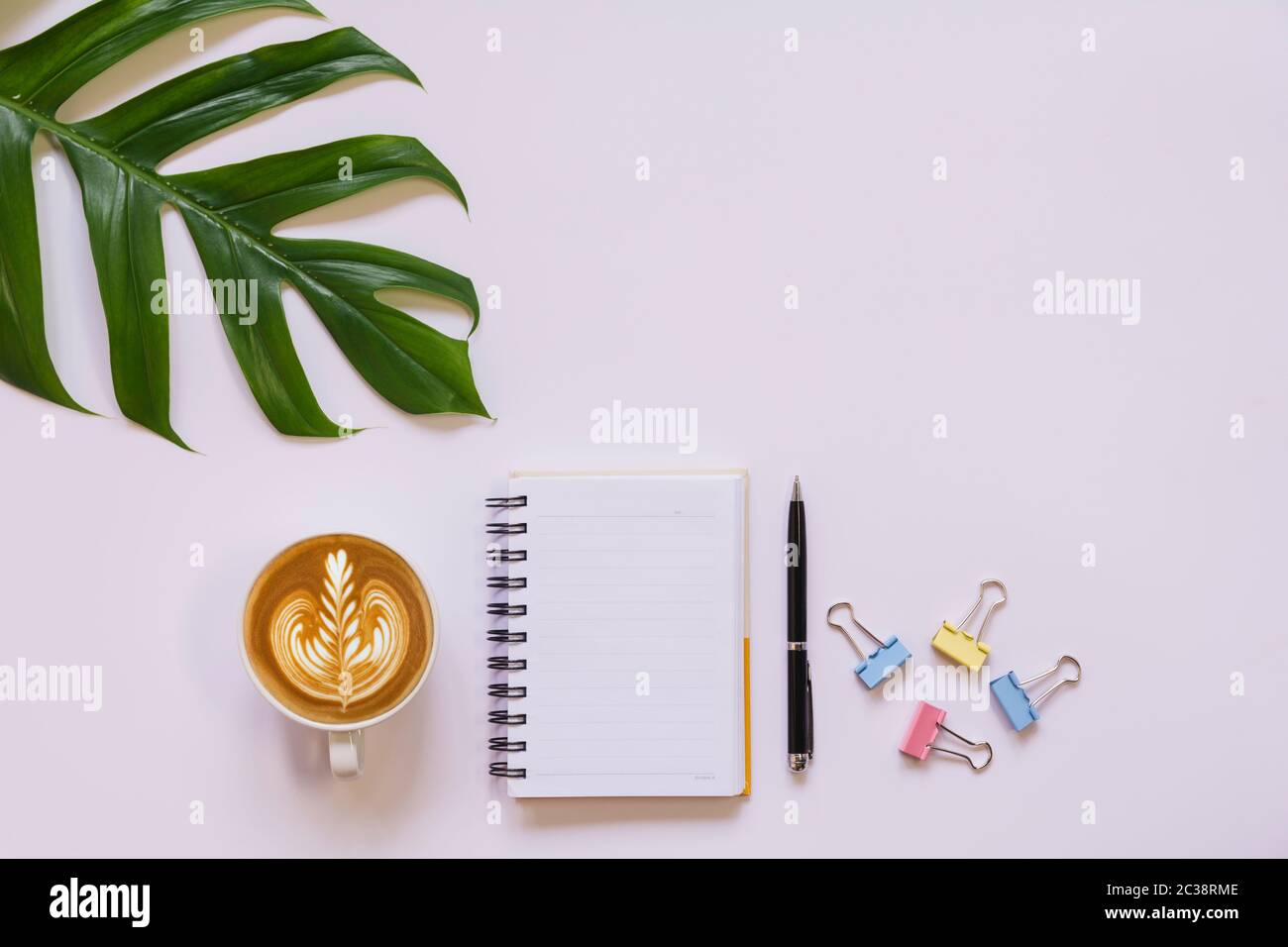 A cup of coffee with note and copy space on white background. Office ...