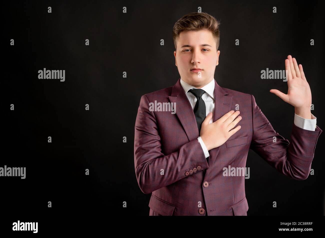 Law student with blond hair dressed in burgundy jacket, white shirt and ...