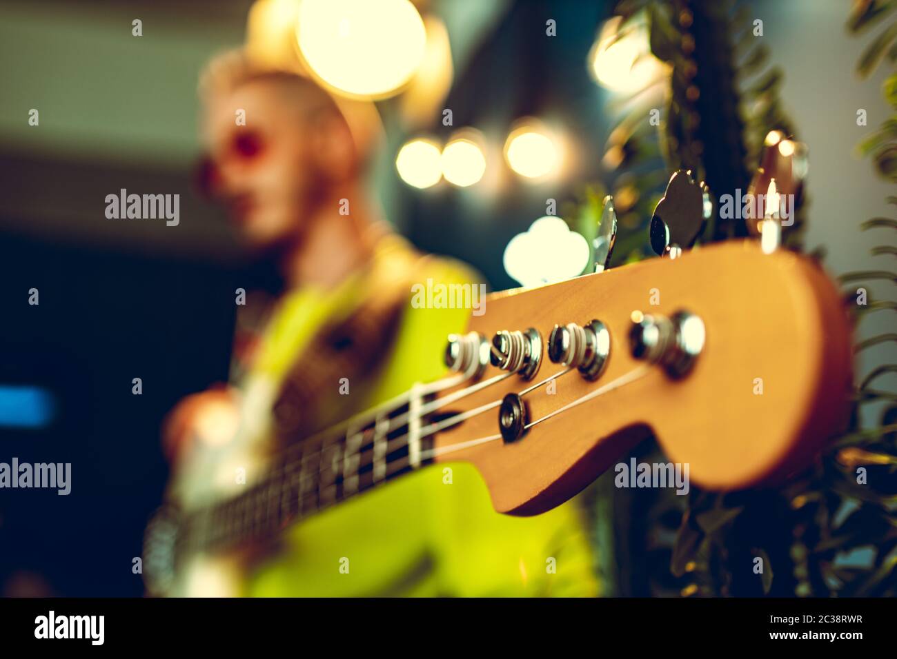 Guitar head with .ring gear on blurred guitarist background Stock Photo ...