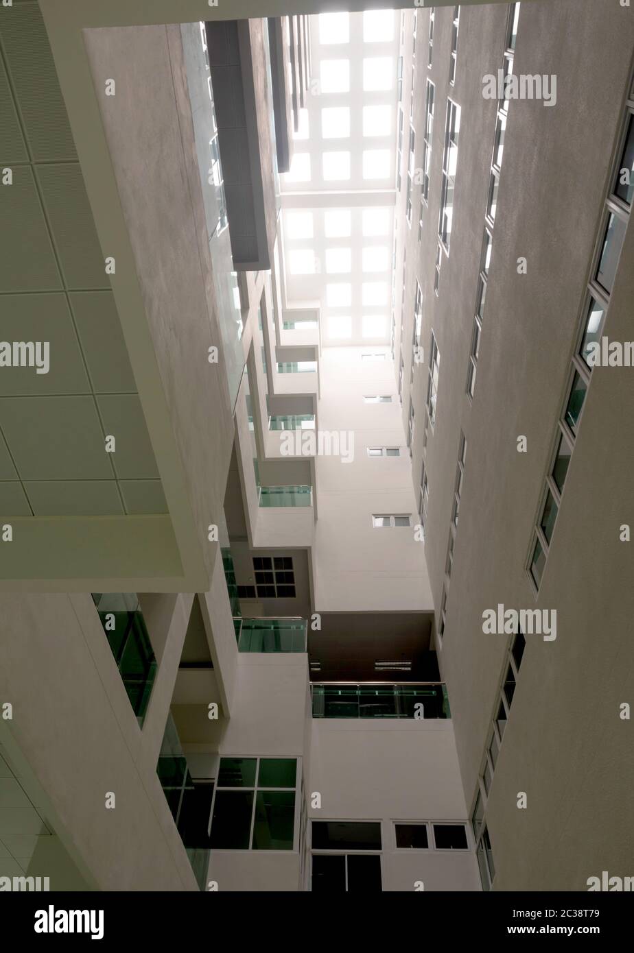 A Low vantage point in hall the high rise building, Looking up to the ...