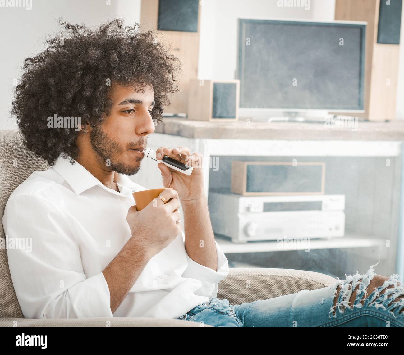 Man smoking cigarette home hi-res stock photography and images - Alamy