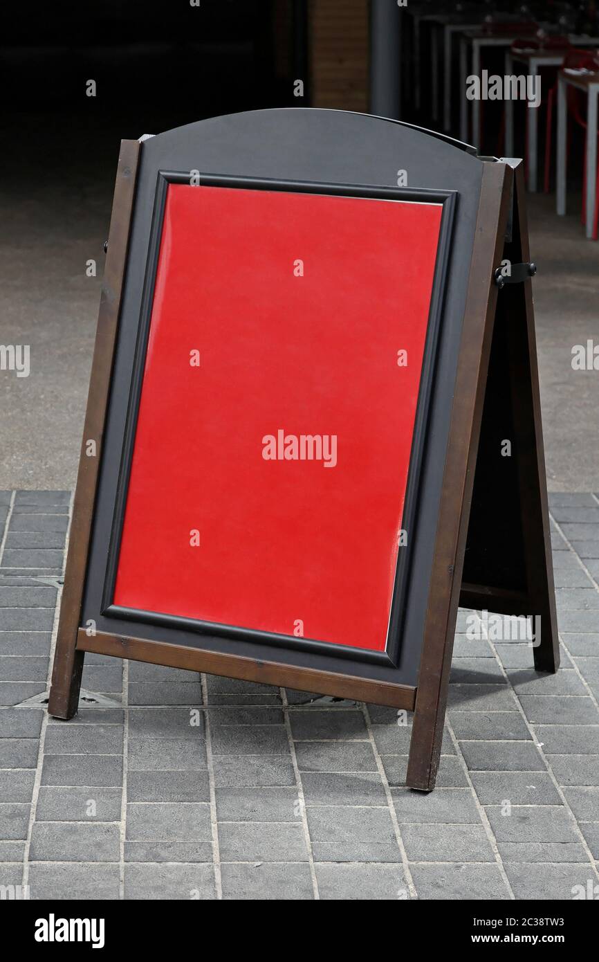Wooden A board with red frame for messages Stock Photo - Alamy