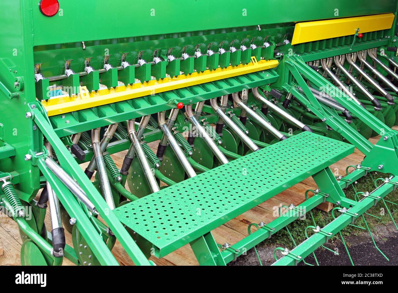 Green seeder planter row machine for agriculture Stock Photo - Alamy