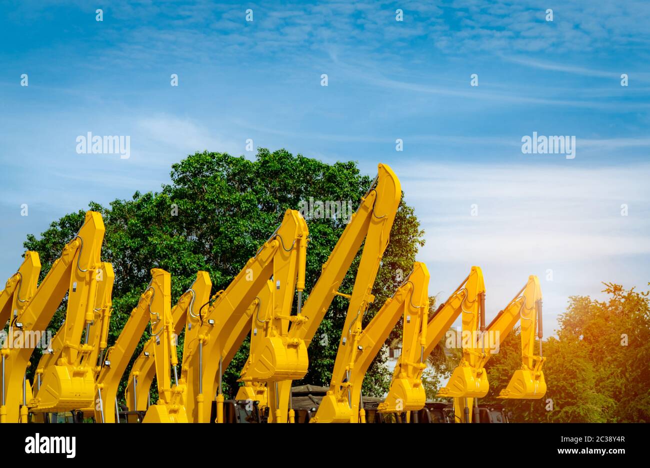 Yellow backhoe with hydraulic piston arm. Huge metal bulldozer ...