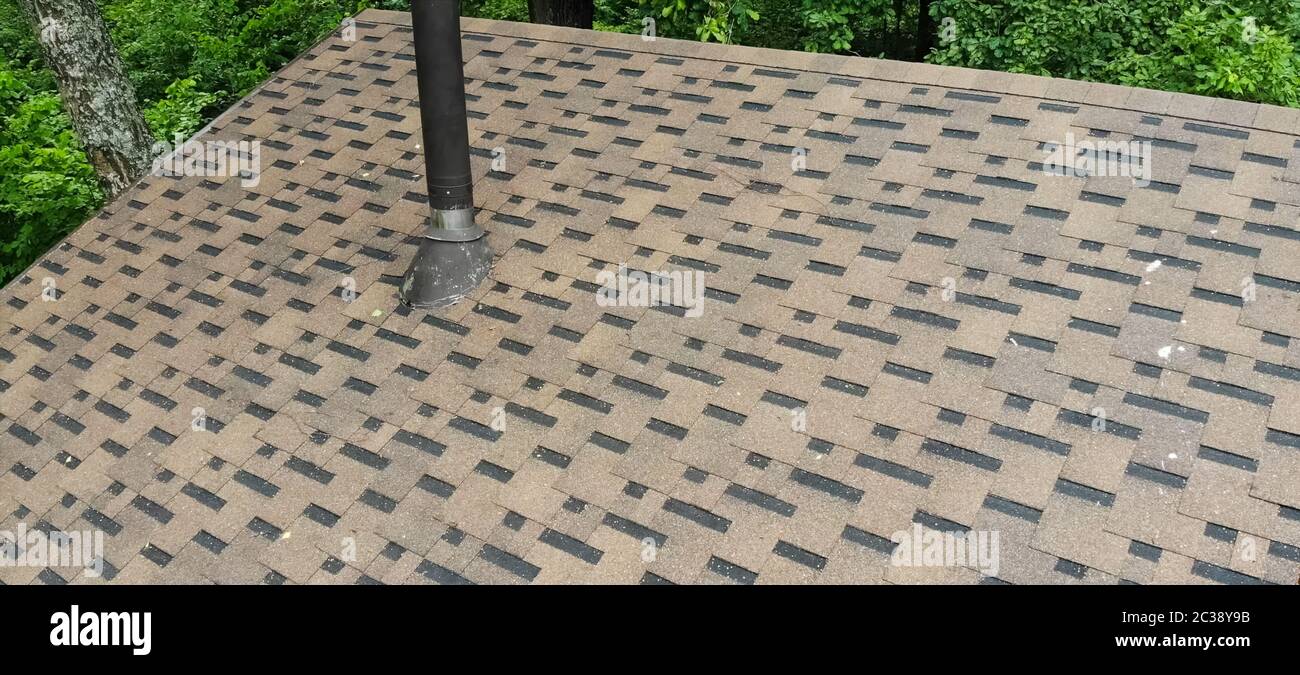 Bituminous tile for a roof. a roof from a bituminous tile Stock Photo ...