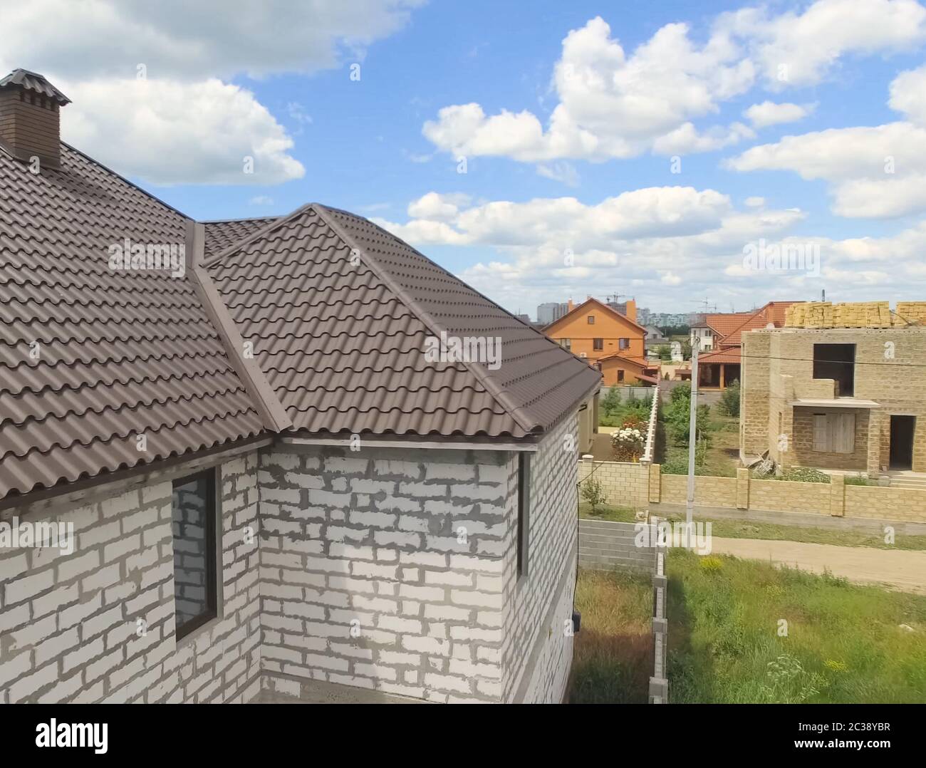 Modern roof made of metal. Corrugated metal roof and metal roofing ...