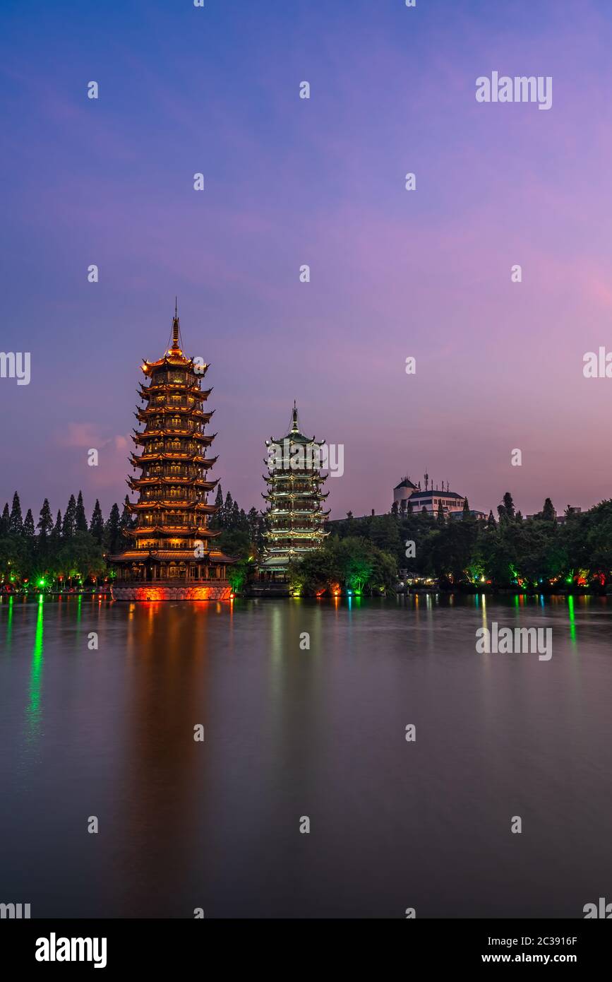 Sun and moon pagodas in Guilin at night Stock Photo - Alamy