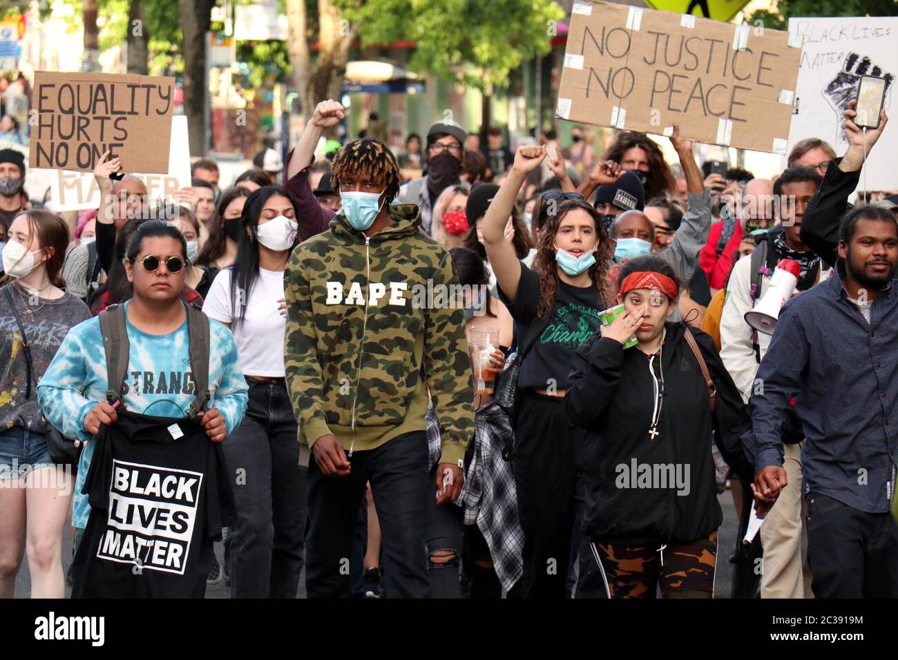 A crowd of about 200 protesters march from the so-called Capitol Hill ...