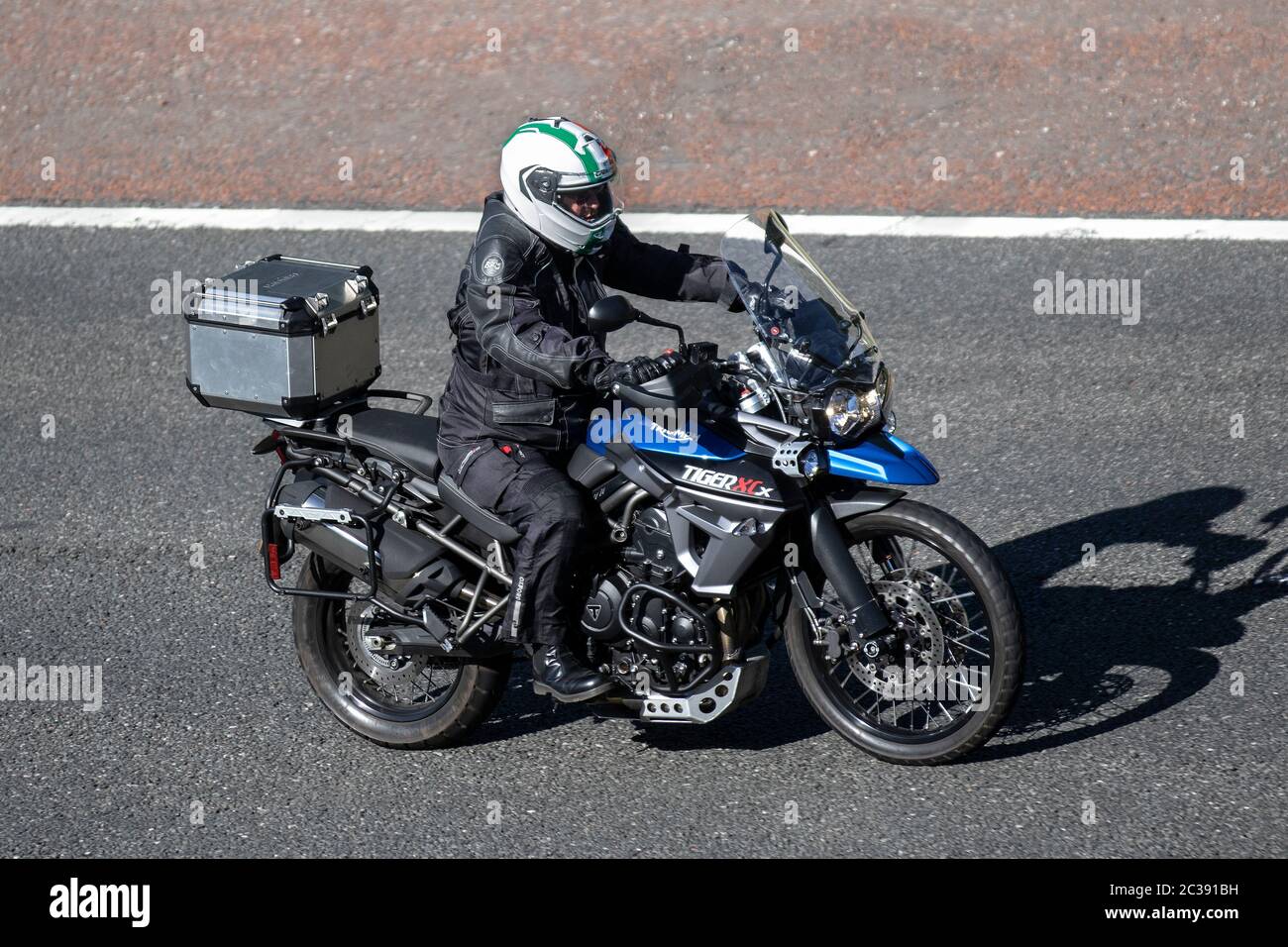 Triumph Tiger XCx Motorbike rider; two wheeled transport, motorcycles ...