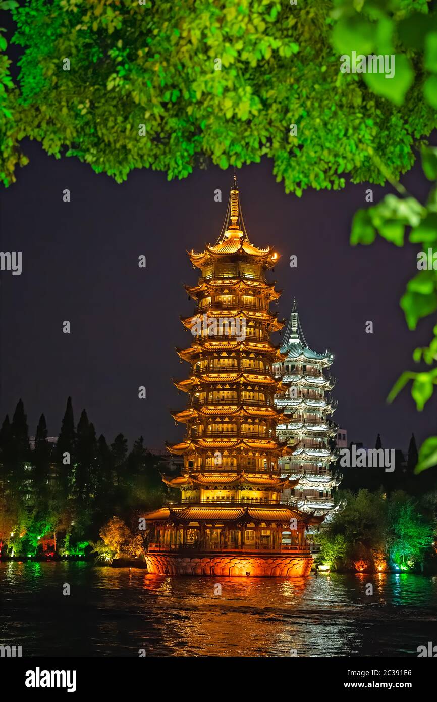 Sun and moon pagodas in Guilin at night Stock Photo - Alamy