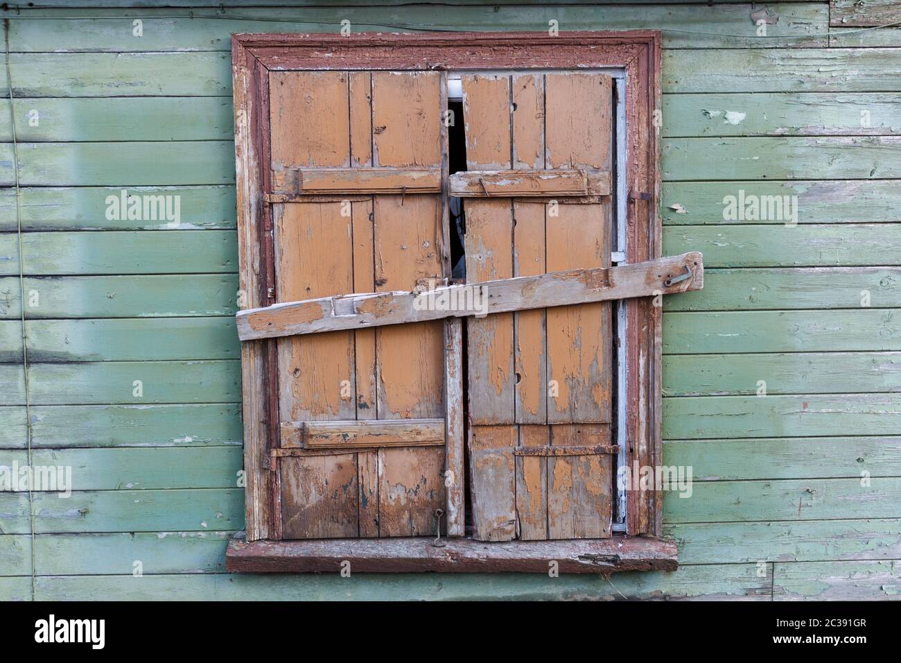 Window closed by wooden planks in an old abandoned building Stock Photo ...