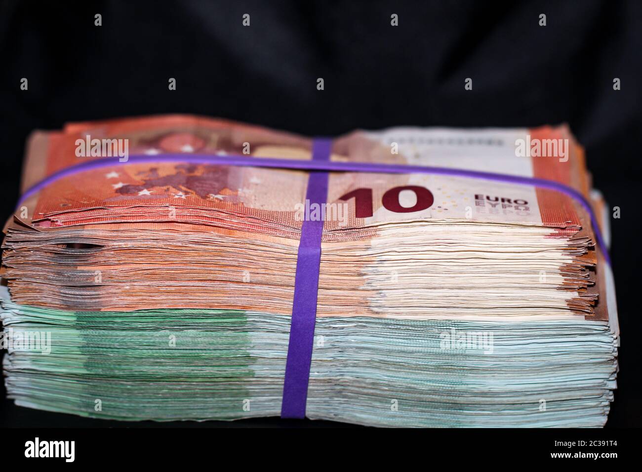 Many banknotes on a stack, euro notes bundled Stock Photo - Alamy