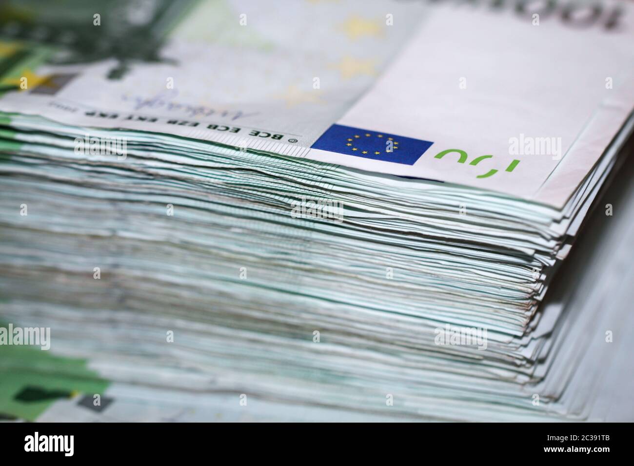 Many banknotes on a stack, euro notes bundled Stock Photo - Alamy