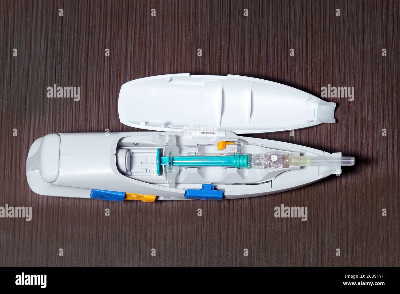 Open auto injector device with injection inserted inside Stock Photo ...