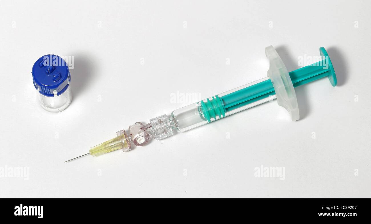 Plastic injection syringe with glass vial medicine on white background ...