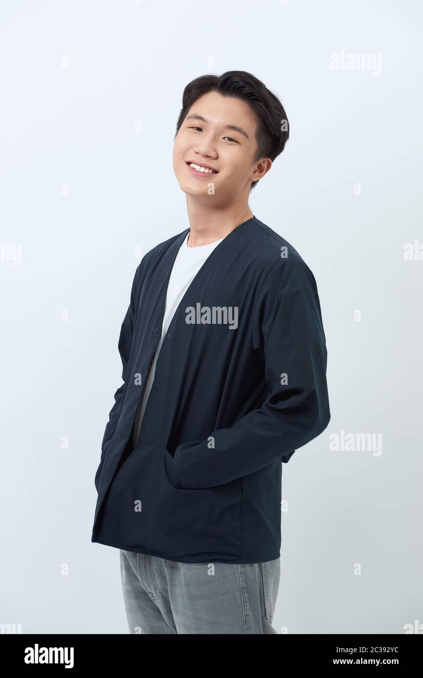 Portrait of friendly asian man wearing blue shirt, smiling Stock Photo ...