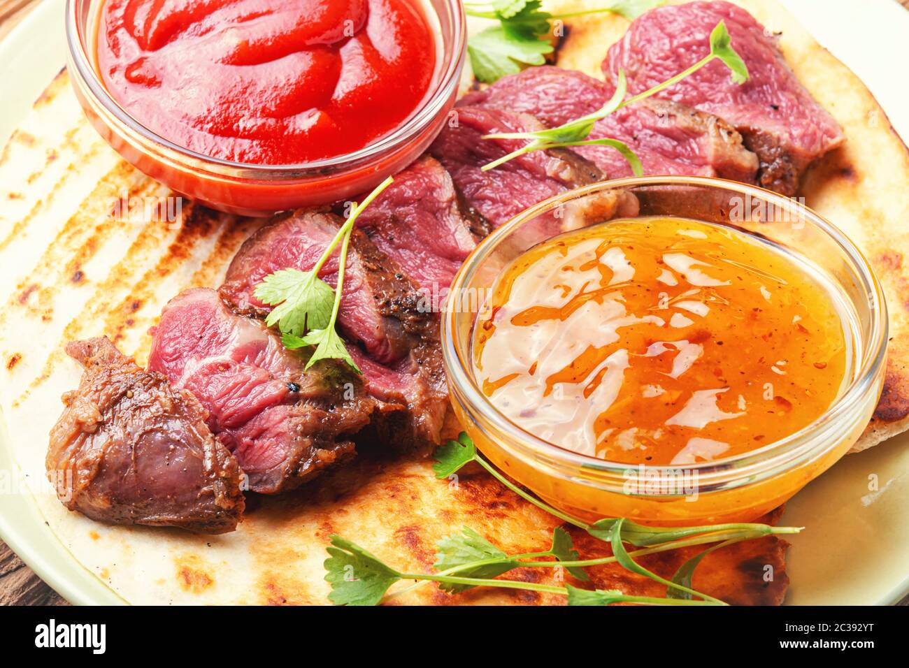 Fried beef bacon on a bread.Roasted bacon with spicy sauce Stock Photo ...