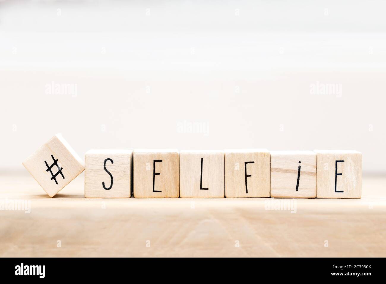 Wooden cubes with a Hashtag and the word selfie background, Social ...