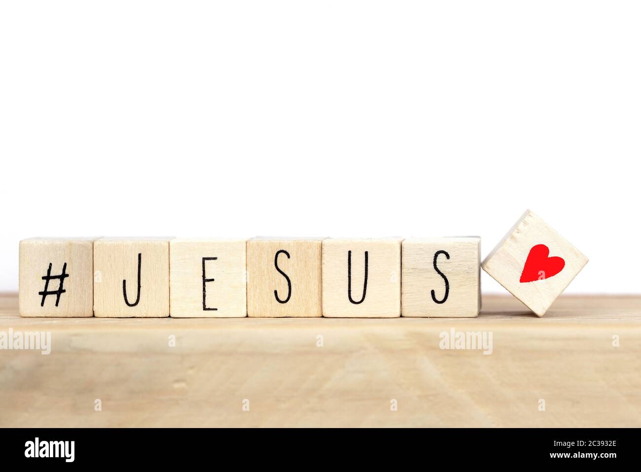 Wooden cubes with a hashtag and the word Jesus, social media concept ...