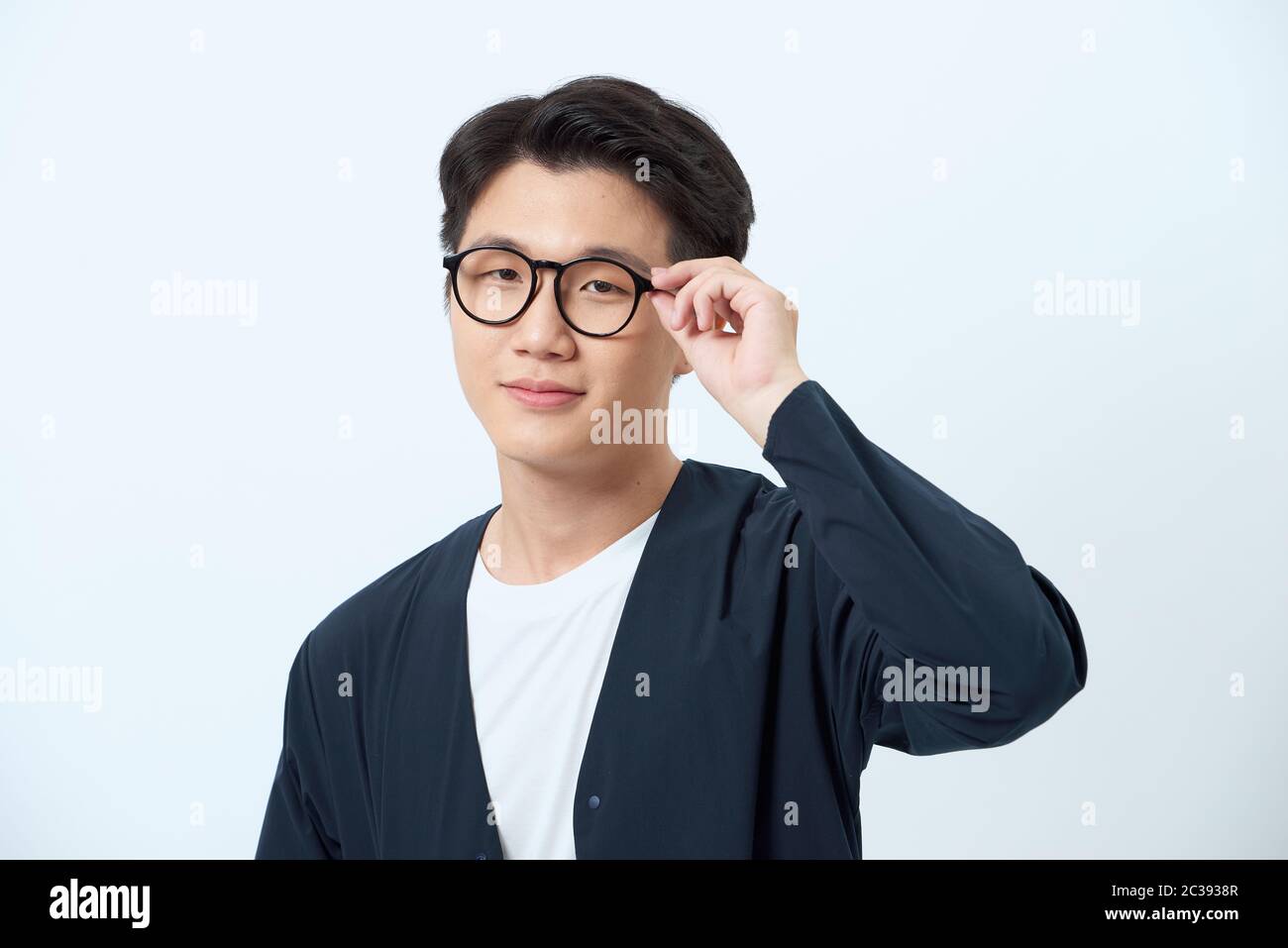 Portrait of friendly asian man wearing blue shirt, smiling Stock Photo ...