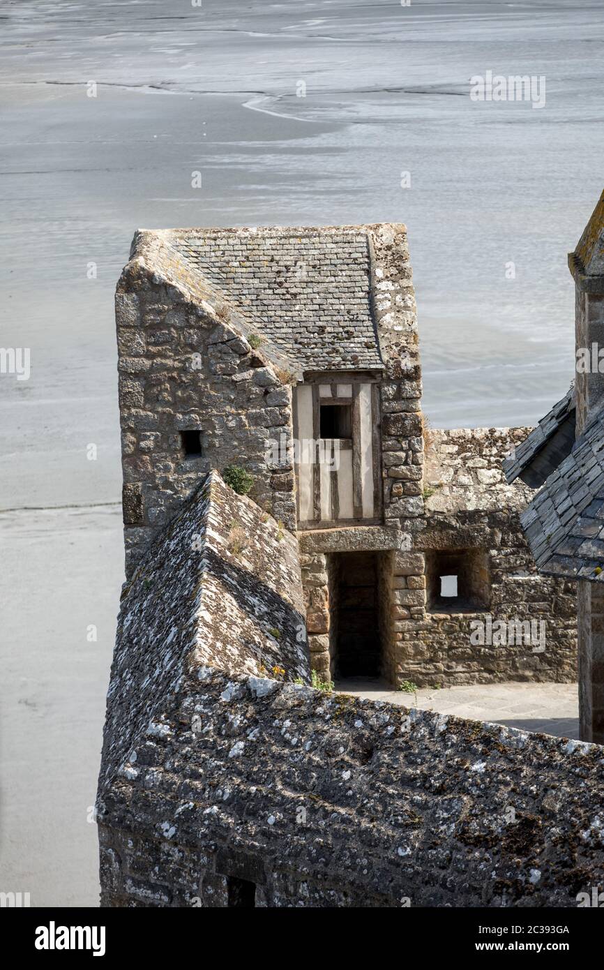 Mont Saint-Michel, the monastery and village on a tidal island between ...