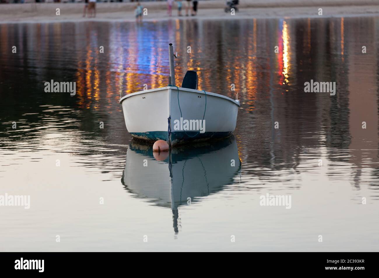 Beautiful Sunset scene with a small boat Stock Photo - Alamy
