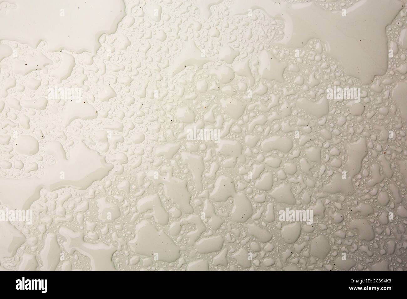 Rain patterns on an outside table Stock Photo - Alamy