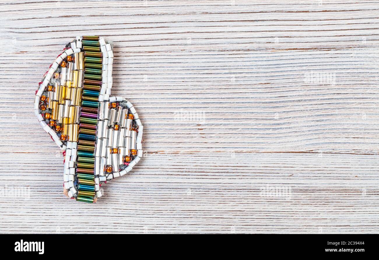 needlecraft background - top view of handcrafted brooch from various ...