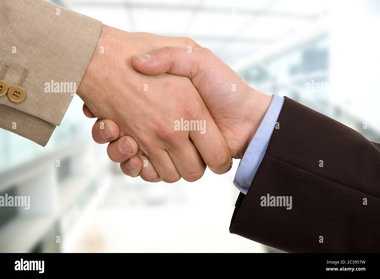 Business team hand shake at the office Stock Photo - Alamy