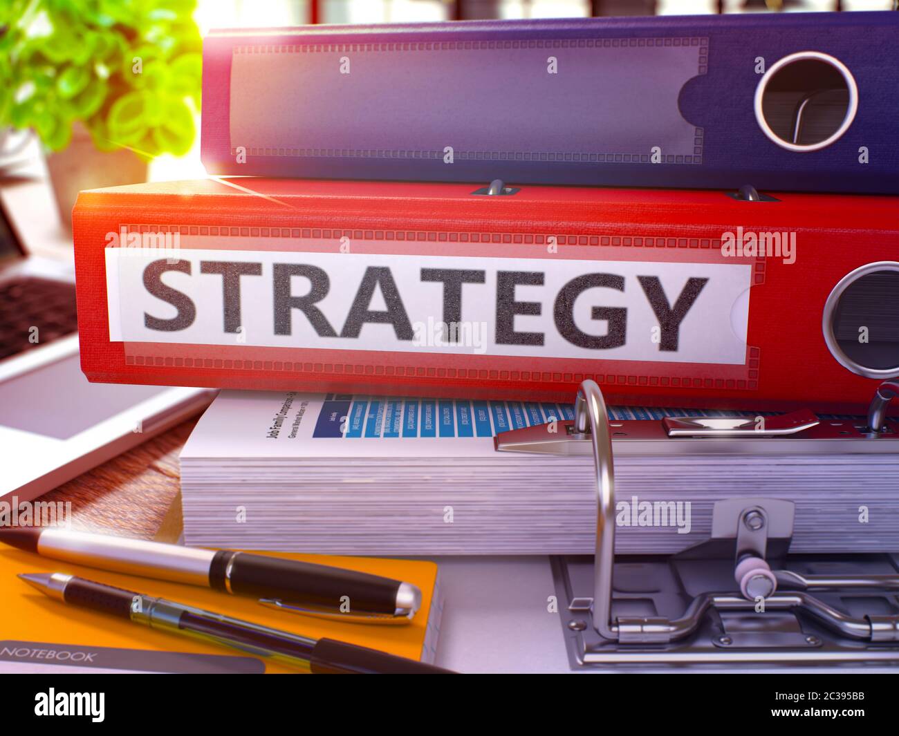Strategy - Red Ring Binder on Office Desktop with Office Supplies and ...