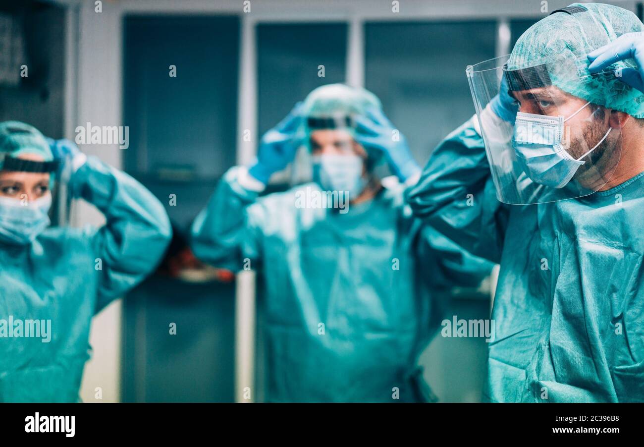Doctors and nurse preparing to work in hospital for surgical operation ...
