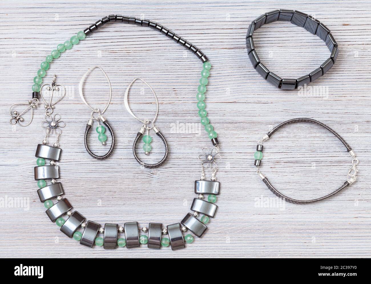needlecraft background - handcrafted necklace and earrings from green ...
