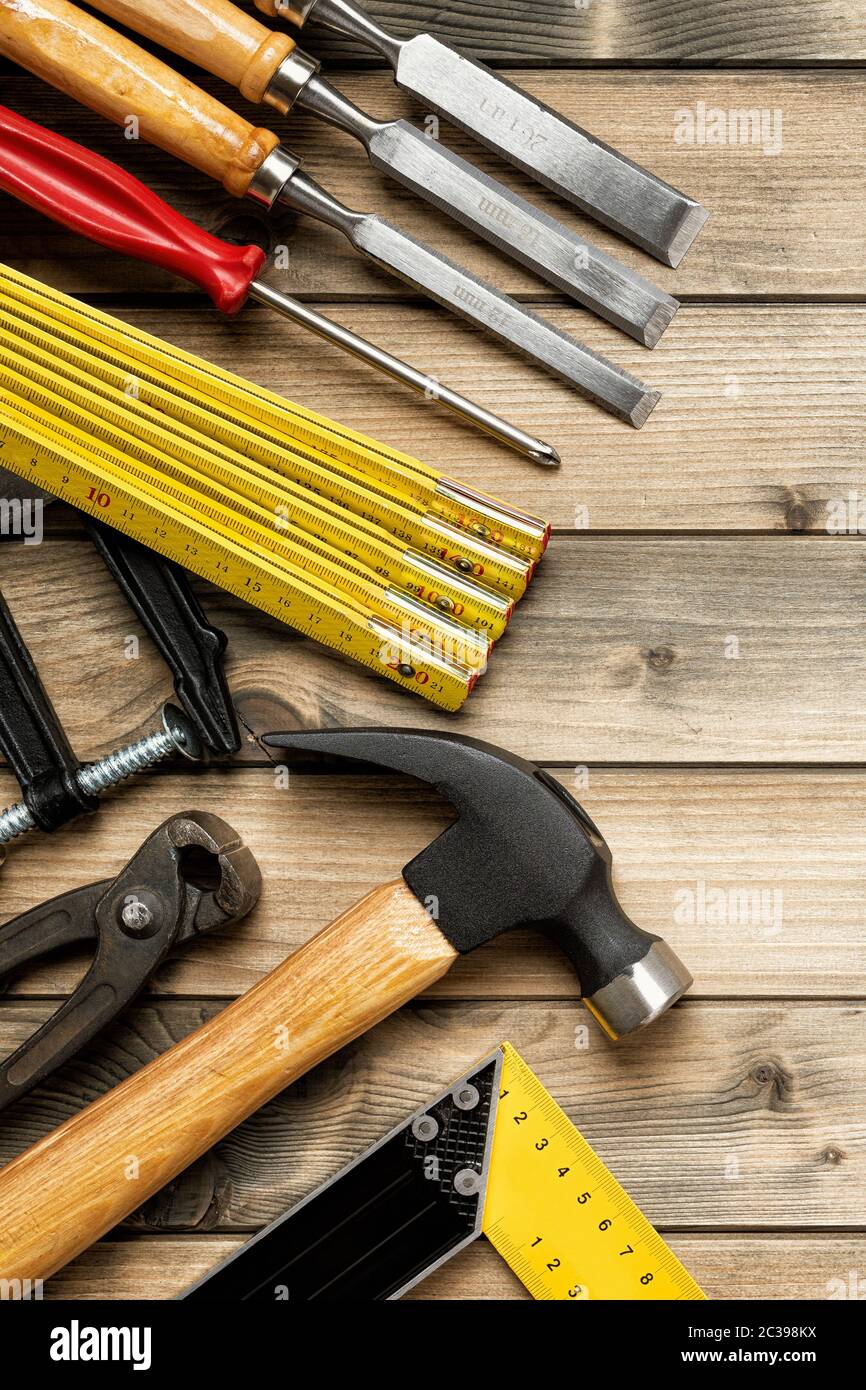 Top view of carpenter work tools on an antique wooden table ...