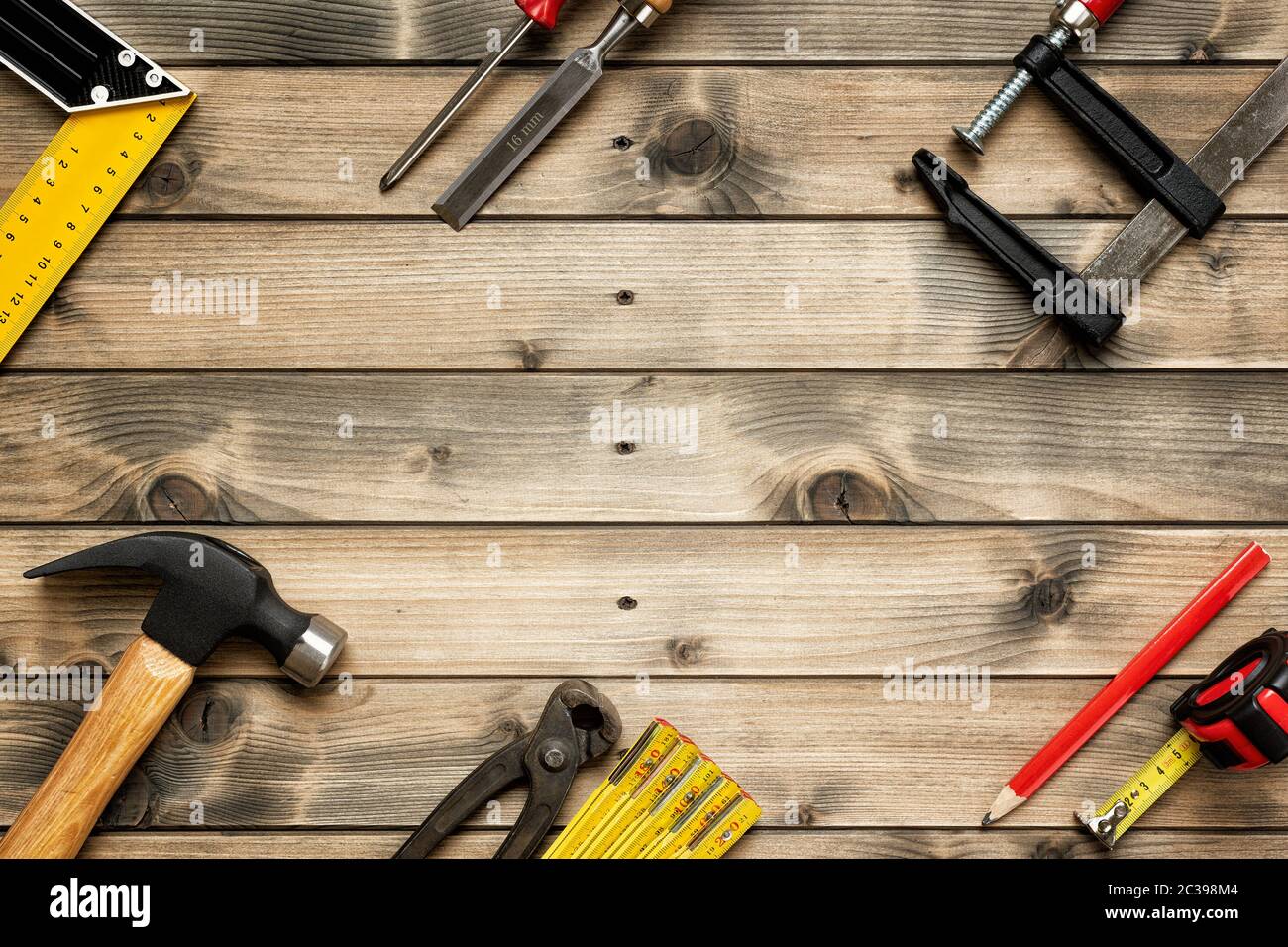 Top view of carpenter work tools on an antique wooden table ...