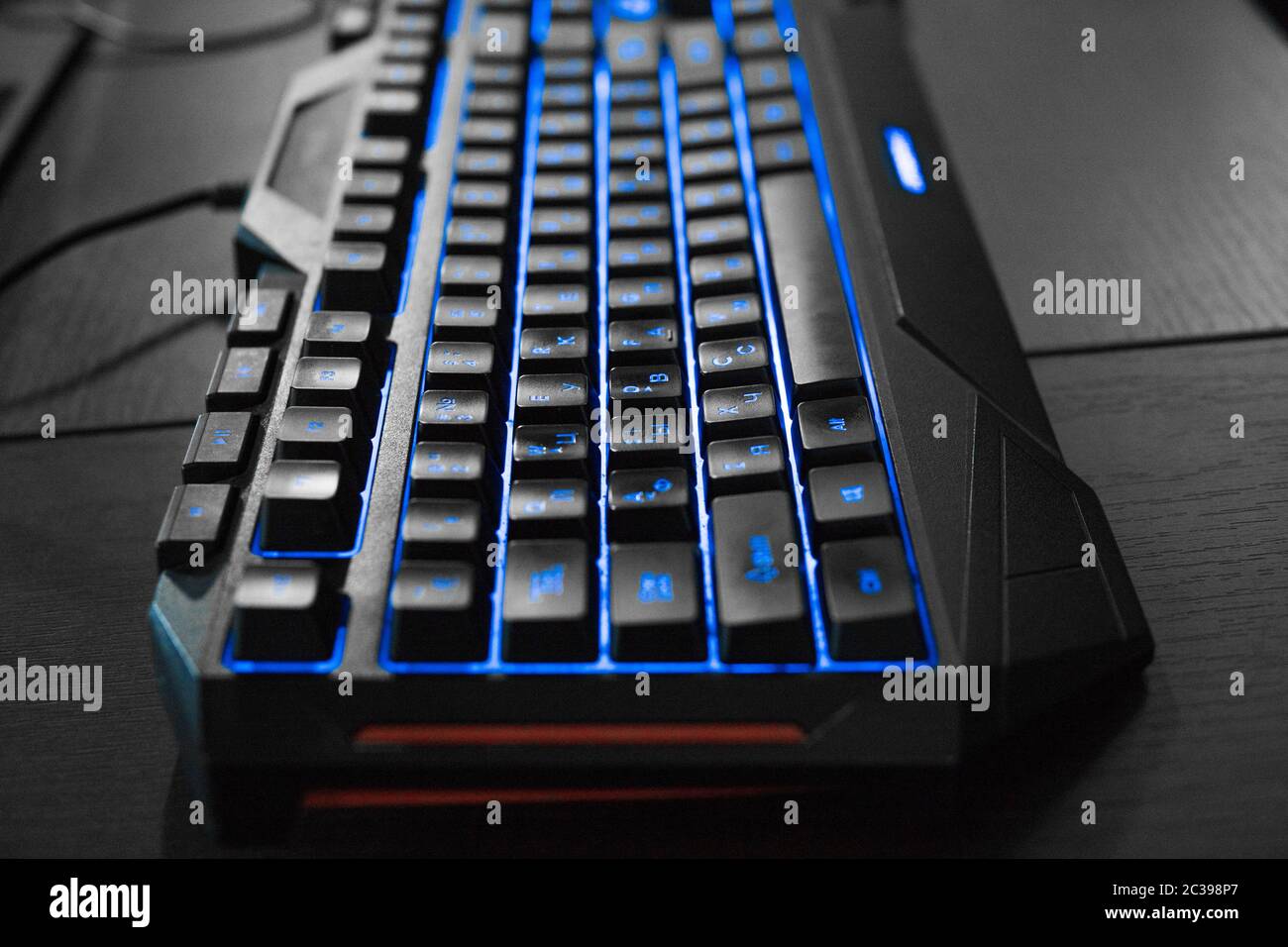 Gamer keyboard with colorful blue lights, modern gamer computer. Blue ...
