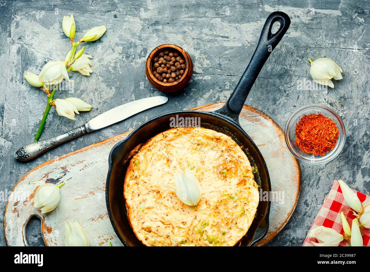 Frying pan with scrambled eggs stuffed with edible yucca flowers ...