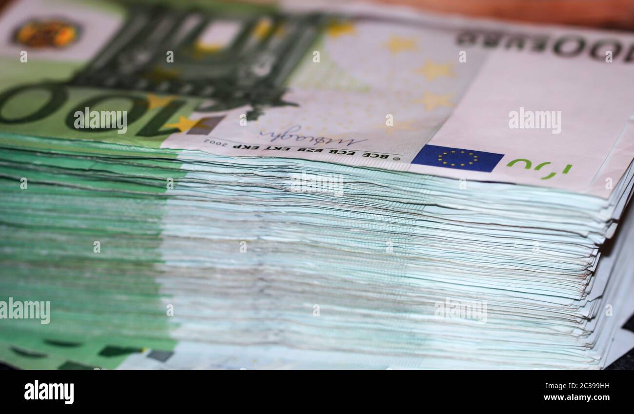 Many banknotes on a stack, euro notes bundled Stock Photo - Alamy