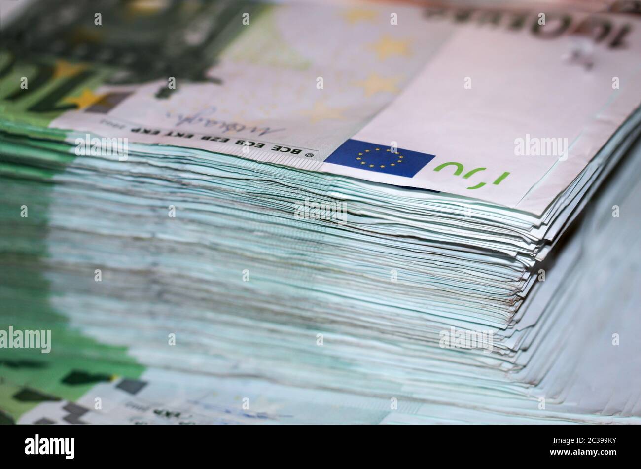 Many banknotes on a stack, euro notes bundled Stock Photo - Alamy