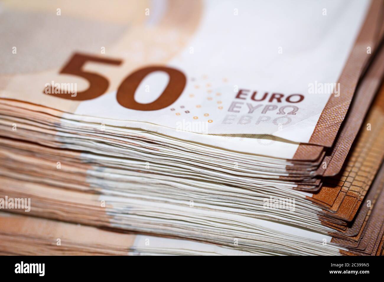 Many banknotes on a stack, euro notes bundled Stock Photo - Alamy