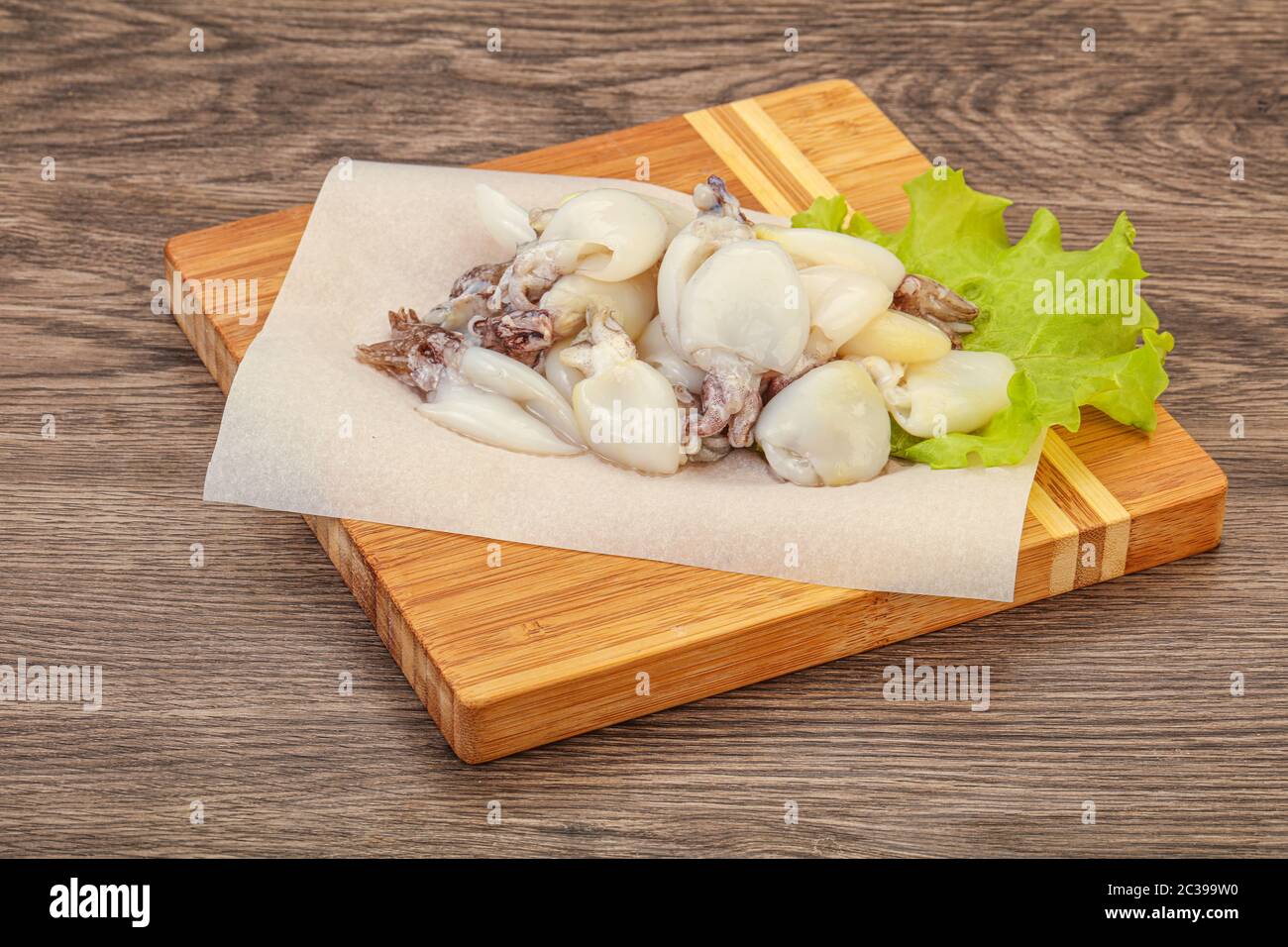 Raw seafood - cuttlefish for cooking over board Stock Photo - Alamy