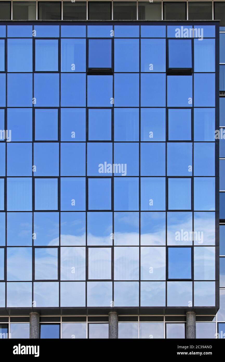 Modern office building exterior with blue glass Stock Photo - Alamy