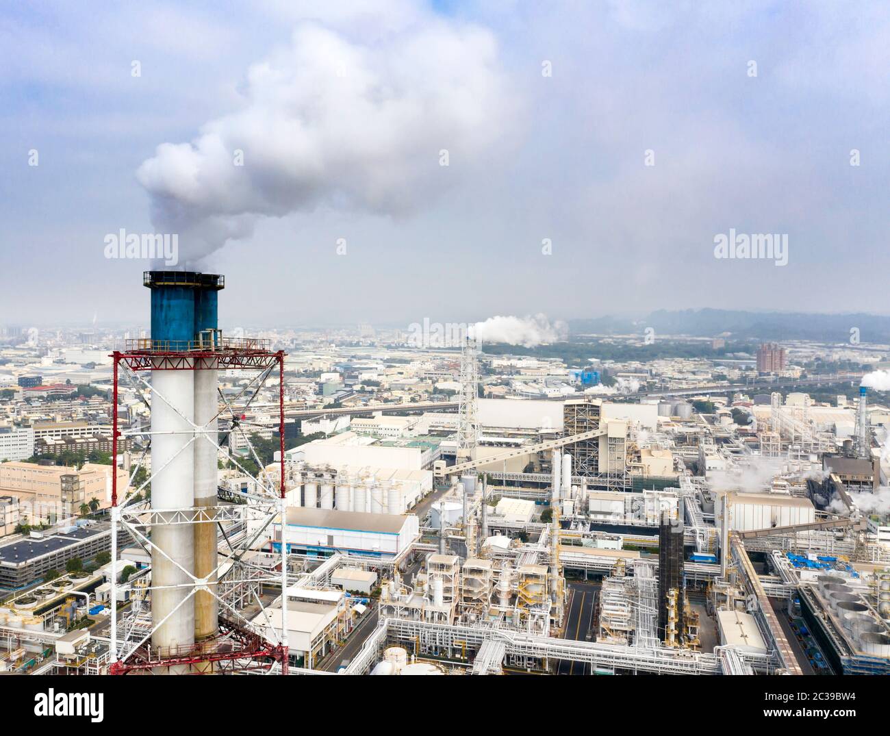 Aerial view of industrial area with chemical plant. Smoking chimney ...