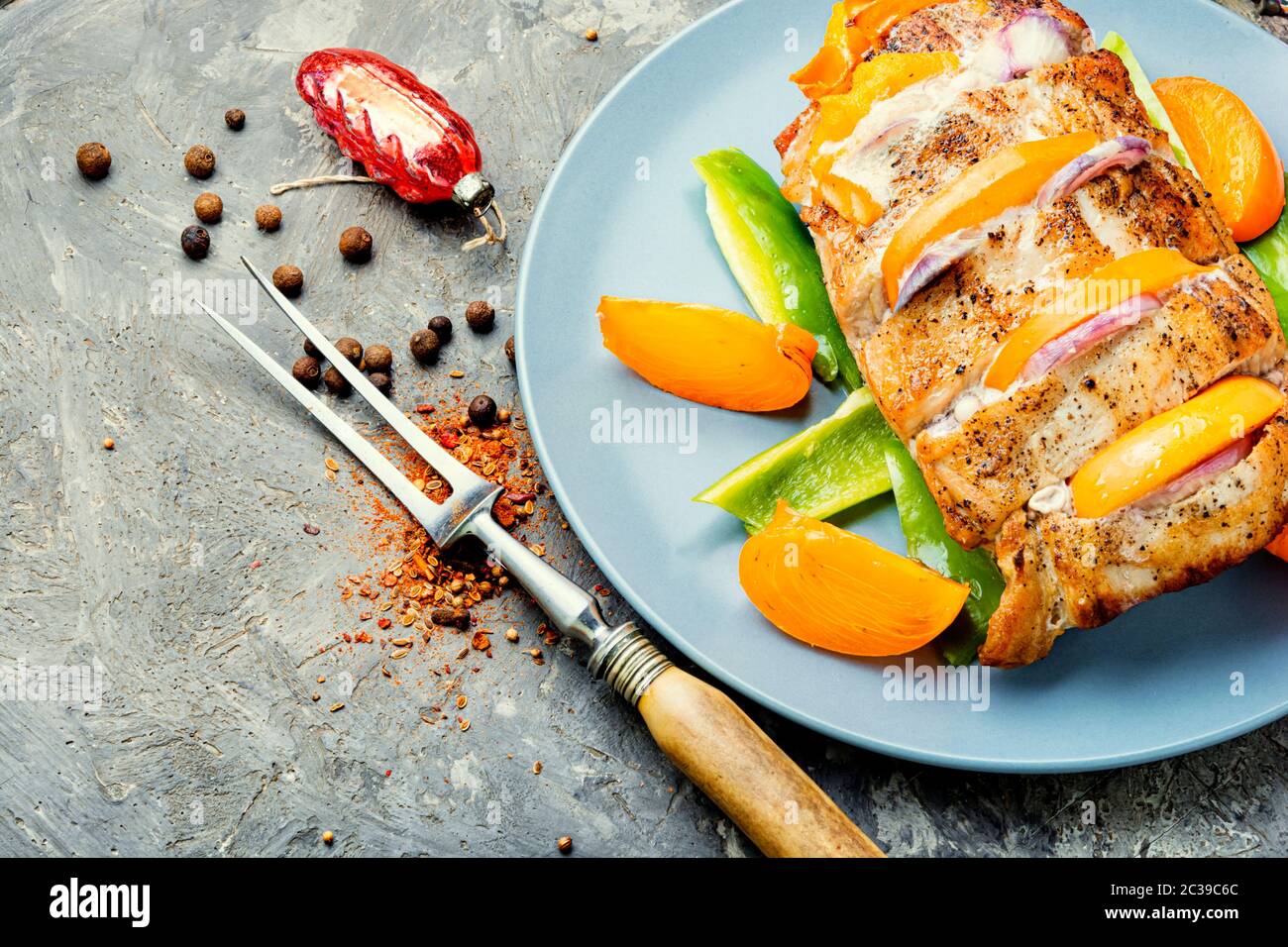 Pork meatloaf baked to the Christmas table.Persimmon baked meat Stock ...