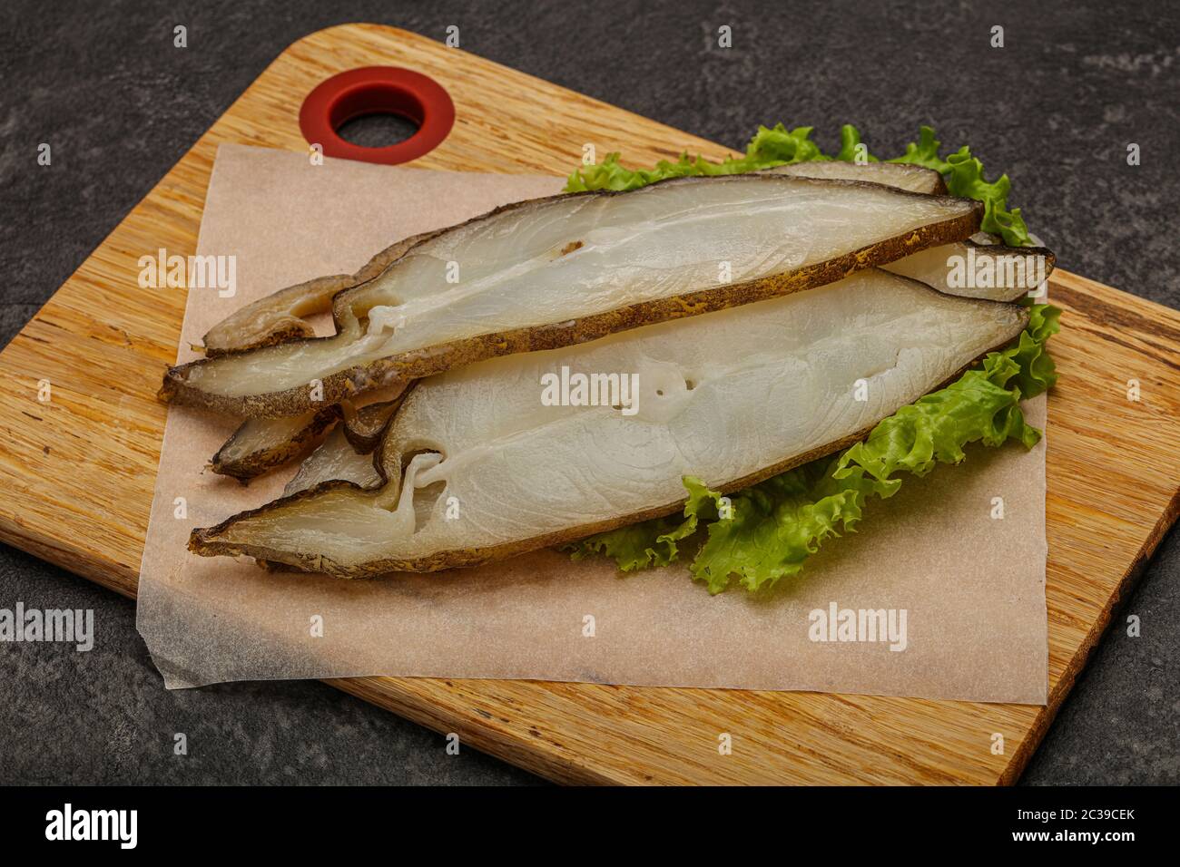 Delicous smoked halibut fish slices snack Stock Photo - Alamy